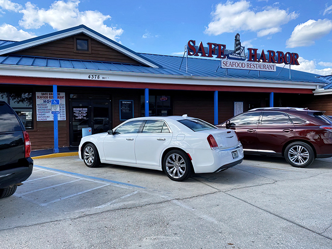 The blue-roofed beacon of seafood salvation stands proudly against Florida's sky, promising treasures that were swimming just hours ago.