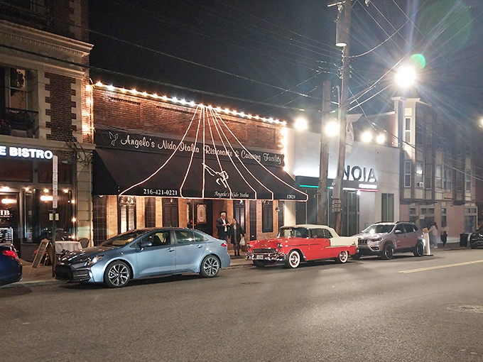 The unassuming brick facade of Angelo's Nido Italia beckons hungry travelers with its classic awning and promise of authentic Italian cuisine within.