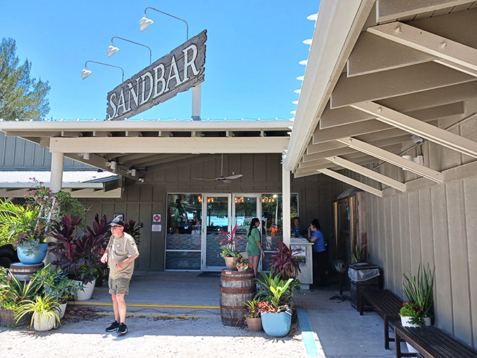 The Sandbar's illuminated sign welcomes night owls and sunset-chasers alike. Florida's coastal magic begins at these doors.