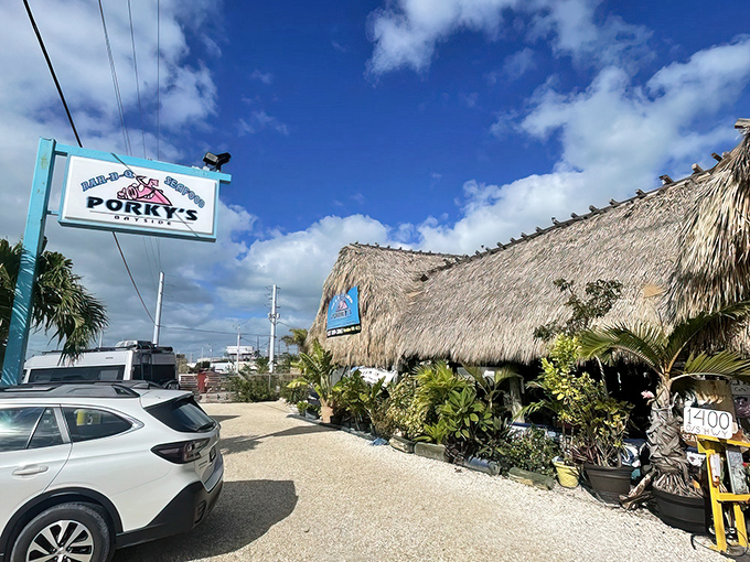 The thatched roof isn't just for show&mdash;it's nature's air conditioning in the Florida Keys. Pelicans perch above while that pink pig beckons you inside.
