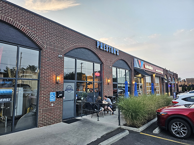 The blue neon "PRESTON'S" sign beckons burger pilgrims like a culinary lighthouse. This unassuming brick storefront houses Columbus's worst-kept delicious secret.