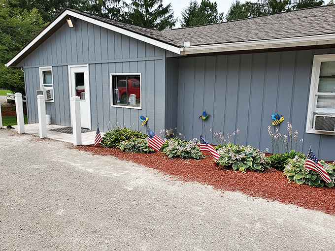 The unassuming blue exterior of Capricorn Inn might not scream "culinary destination," but those American flags hint at the patriotic duty of serving incredible burgers inside.