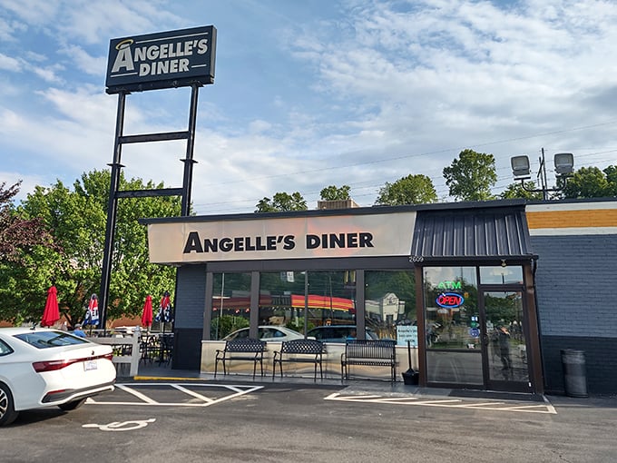 The blue-and-white beacon of Angelle's Diner stands proud against the Virginia sky, promising comfort food that'll make your taste buds stand at attention.