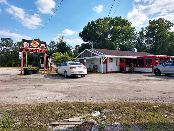 The unassuming red and white exterior might fool you, but Florida BBQ pilgrims know better—culinary magic happens behind these humble walls.