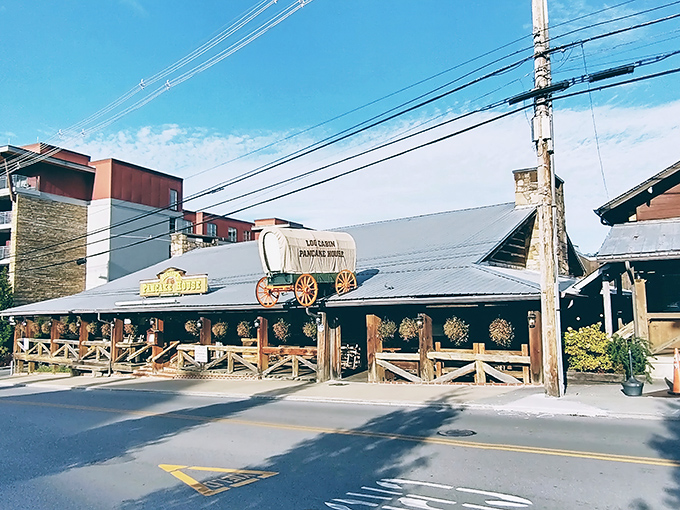 The iconic covered wagon perched atop Log Cabin Pancake House announces your arrival at breakfast nirvana. Gatlinburg's skyline and mountains create the perfect backdrop.