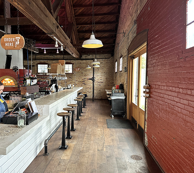 The rustic brick exterior of Humble Wood Fire beckons like an old friend, promising warmth and deliciousness within its walls.