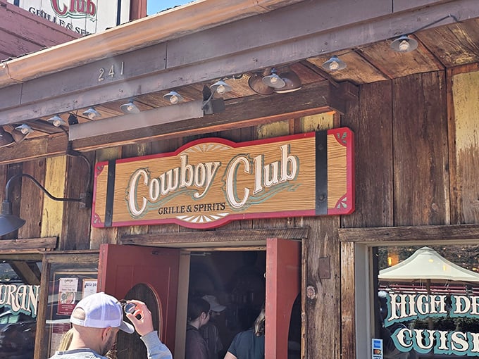 The Cowboy Club's rustic wooden exterior welcomes you like an old friend, with those magnificent Sedona red rocks playing backdrop to your culinary adventure.