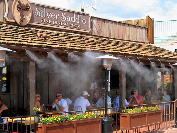 This weathered wooden facade whispers tales of cowboys and cattle drives while promising modern culinary adventures inside.