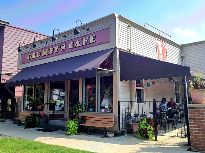 Sunshine meets comfort food at Grumpy's Cafe, where the cheerful yellow exterior and bold red sign promise a breakfast experience worth getting out of bed for.