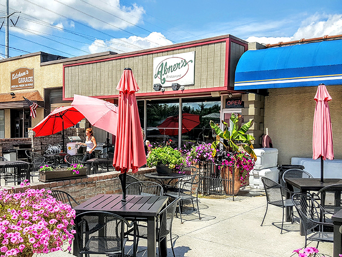 Abner's welcomes you with colorful umbrellas and flower-filled planters, creating the perfect outdoor oasis for sipping coffee and watching Hilliard wake up.