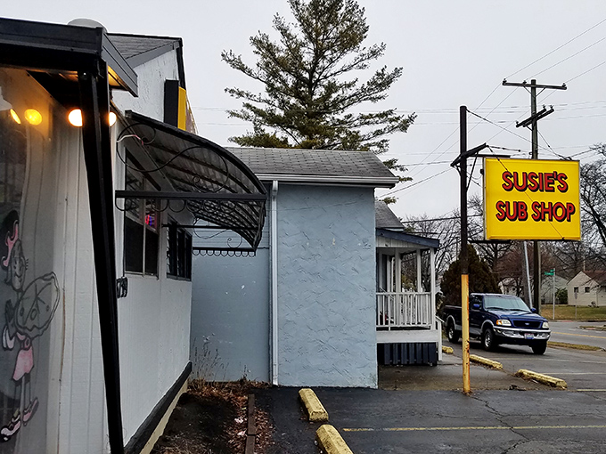 The unassuming white building with its bright yellow sign promises sandwich salvation to those in the know. No frills, just thrills.