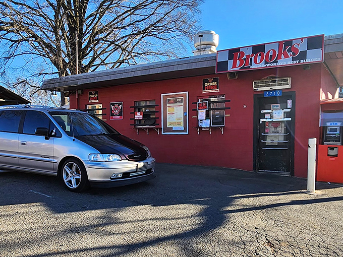 The little red cinderblock building that could. Brooks' Sandwich House stands defiantly unchanged while Charlotte's NoDa neighborhood transforms around it.