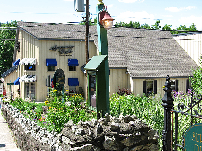 The charming exterior promises culinary adventures ahead, with blue awnings beckoning like a lighthouse for hungry souls.