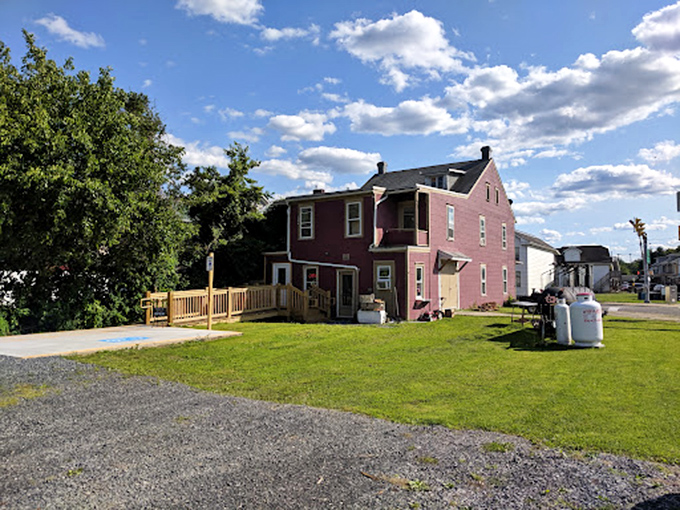 The unassuming red brick building houses barbecue magic that would make even the most dedicated meat pilgrim weep with joy.