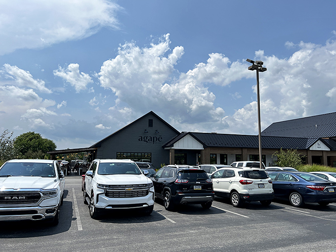 The modern farmhouse exterior of Agapē Cafe & Grille stands proudly against Pennsylvania's blue skies, promising culinary adventures within those charcoal-gray walls.