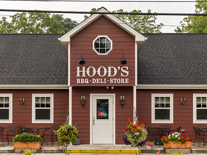 The red barn-like exterior of Hood's BBQ stands as a beacon of smoky promise against the Pennsylvania sky.