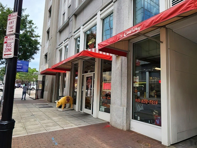 The iconic red awning and pig statue welcome you to Clyde Cooper's &ndash; where barbecue dreams come true since 1938.