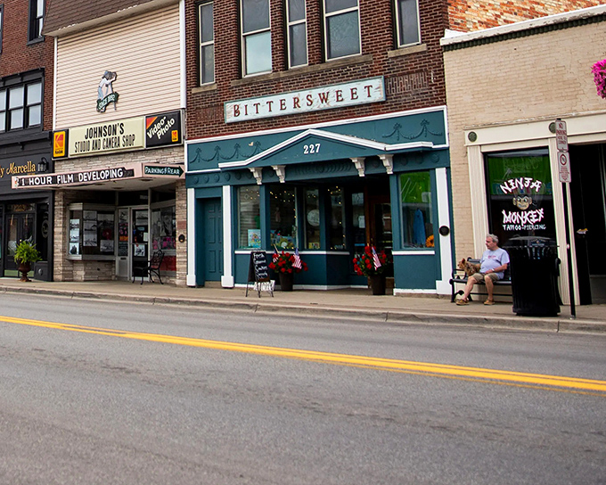 Bittersweet Bistro anchors Main Street with its teal facade, proving small towns know how to do charming storefronts better than any big city designer.