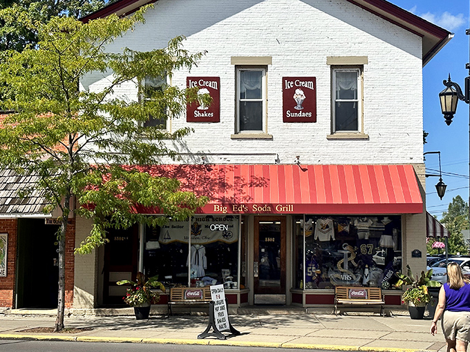 The classic white brick façade with its cherry-red awning isn't trying to be retro—it's the real deal that's been serving Vermilion memories for generations.