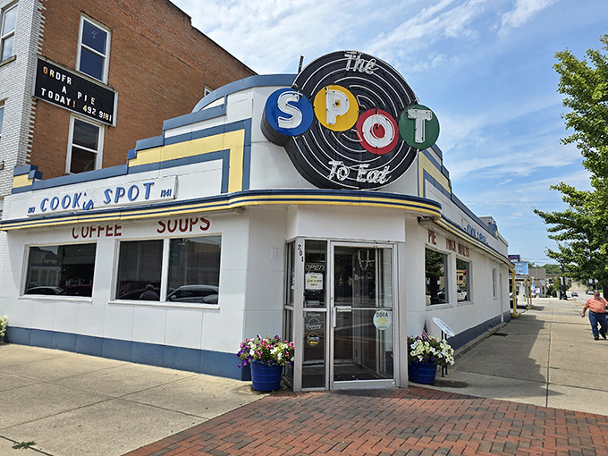 The iconic circular "SPOT" sign has been guiding hungry travelers to this Sidney landmark for generations, a beacon of comfort food in a sea of chain restaurants.