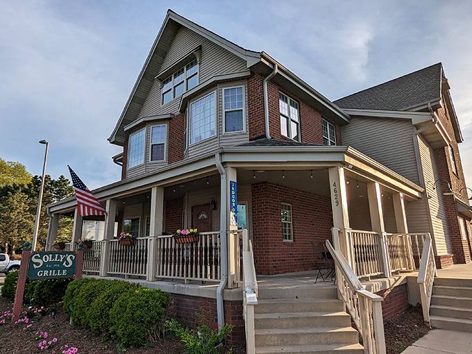 Solly's Grille stands proudly in its charming brick building, complete with a welcoming front porch that practically whispers, "Come in, loosen your belt, stay awhile."