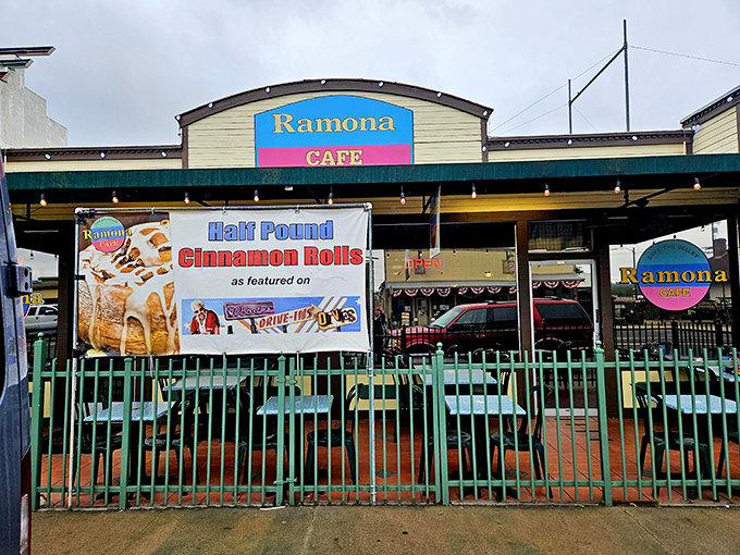 The promised land of breakfast awaits behind this cheerful facade, where that banner proudly announces what pilgrims travel miles to taste.