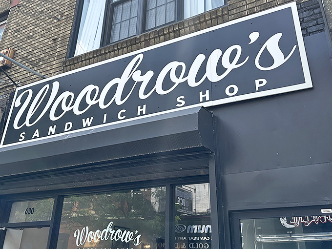 The sleek black and white signage of Woodrow's beckons sandwich pilgrims like a culinary lighthouse on South Street's bustling shores.