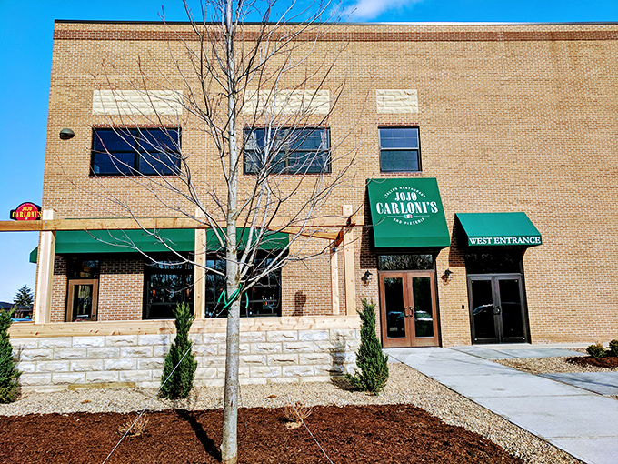 The brick exterior of Jo Jo Carloni's with its signature green awnings stands like a culinary lighthouse in Berea, beckoning hungry travelers to authentic Italian shores.