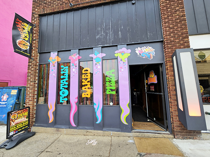 The psychedelic storefront of Totally Baked announces itself with vibrant colors that practically scream "this isn't your average pizza joint." Welcome to flavor wonderland.