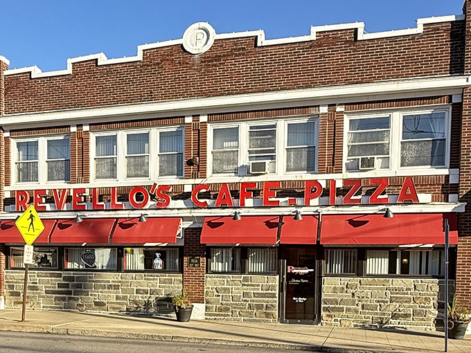 The brick facade and bright red awnings of Revello's stand as a beacon of comfort food in Old Forge, where pizza traditions run deeper than coal mines.