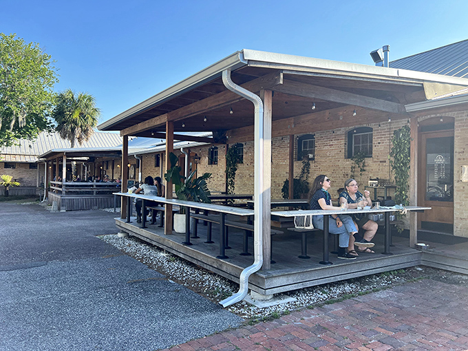 The rustic brick exterior of Humble Wood Fire beckons like an old friend, promising warmth and deliciousness within its walls.