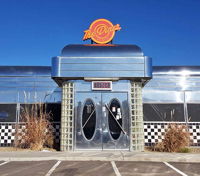 The gleaming chrome exterior of Diner on Main stands like a time machine in the Arizona desert, beckoning hungry travelers with its classic 1950s silhouette.