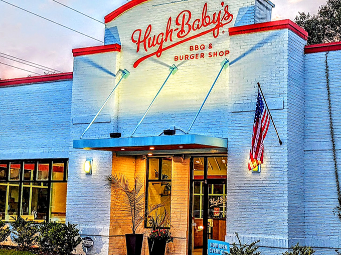The white brick fortress of flavor! Hugh-Baby's crisp exterior with its bold red trim promises burger paradise before you even step inside.