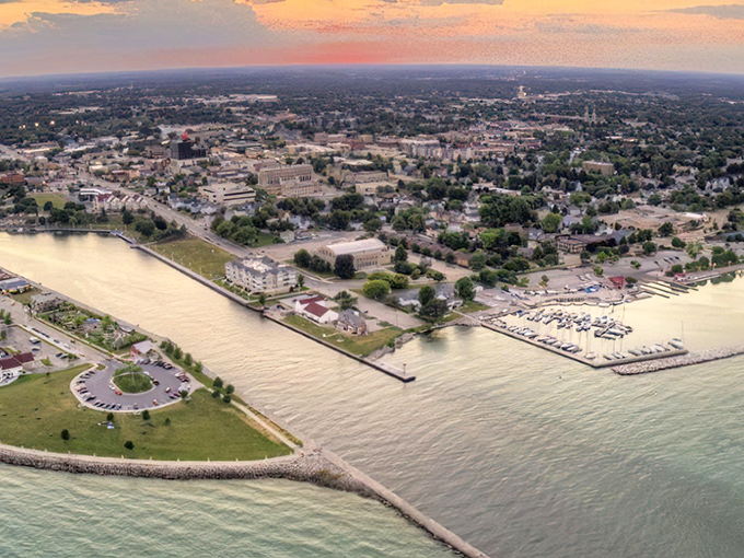 Sheboygan's golden-hour skyline stretches along Lake Michigan like nature's perfect postcard. Retirement with a view? Yes, please!