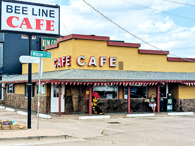 The iconic yellow exterior of Beeline Cafe stands like a beacon of breakfast hope on Payson's main drag, promising comfort food salvation to hungry travelers.