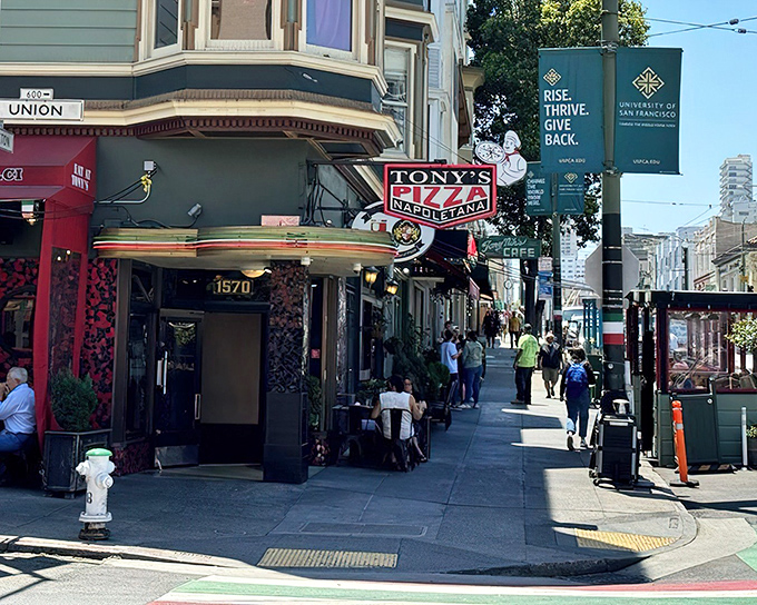 The iconic red and black exterior of Tony's Pizza Napoletana stands as a beacon for pizza pilgrims in San Francisco's North Beach neighborhood.