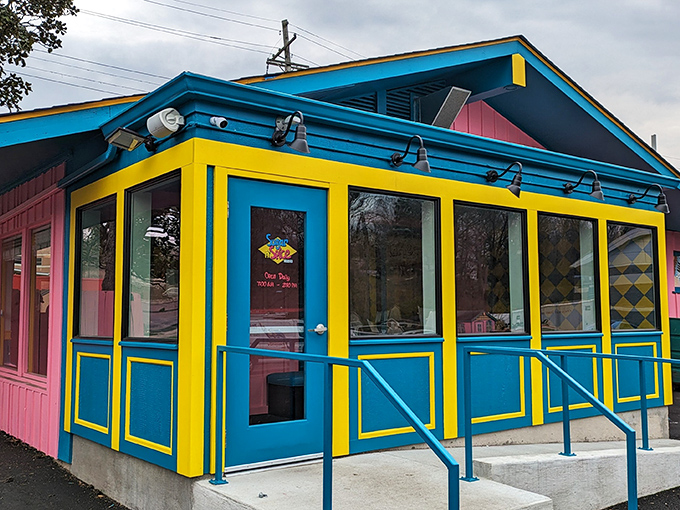 When a building decides to cosplay as pure joy, you get Sugar n' Spice's rainbow exterior.
