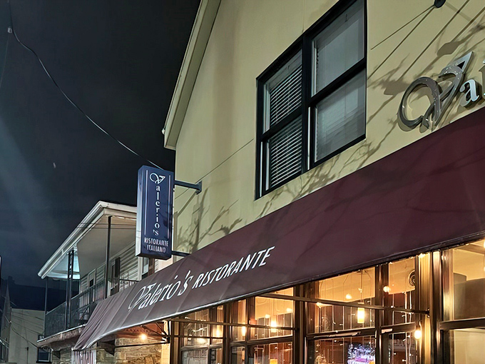 The burgundy awning and warm glow of Valerio's at night&mdash;like a beacon calling all pasta pilgrims home to roost.