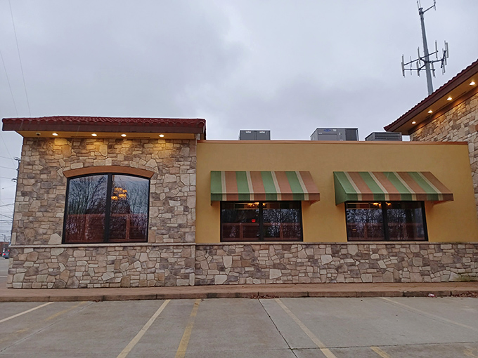 The stone and stucco exterior of Stancato's stands like a culinary fortress, its red-tiled roof and striped awnings promising Italian treasures within.