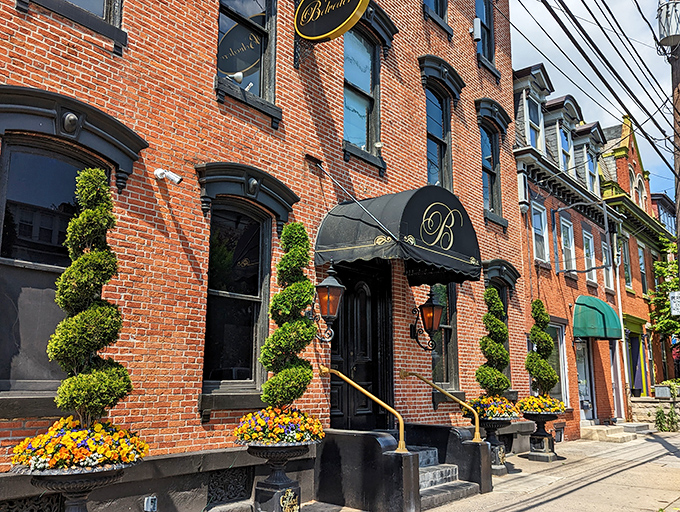 The elegant brick fa&ccedil;ade of The Belvedere Inn welcomes you with spiral topiaries and colorful flower displays. Victorian charm meets culinary excellence.