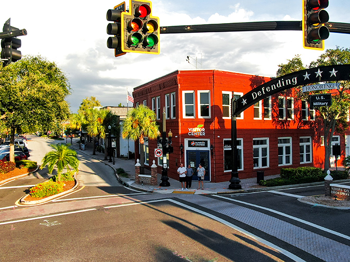Downtown Dunedin's vibrant intersection showcases the town's colorful character. That bright red building isn't just eye-catching&mdash;it's a beacon of the community spirit that makes this place special.