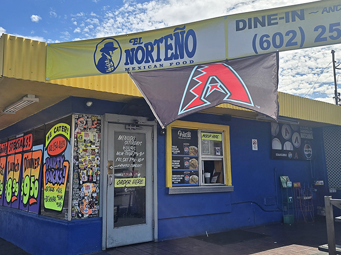 The blue building with the yellow sign isn't trying to impress anyone - it's too busy making what locals consider Arizona's best burritos.
