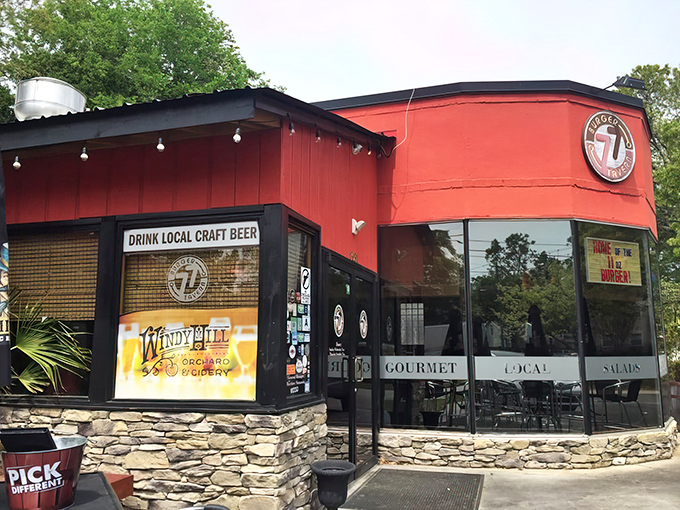 The bright red exterior of Burger Tavern 77 stands out like a beacon for burger enthusiasts, promising gourmet comfort in Columbia's Devine Street district.
