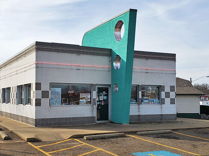 That iconic teal fin isn't just architectural flair&mdash;it's a beacon calling hungry time-travelers to Alliance's most authentic slice of the 1950s.