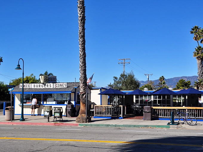 The quintessential California beach shack dream&mdash;palm trees, blue skies, and a sign promising the holy trinity: shakes, burgers, cones.