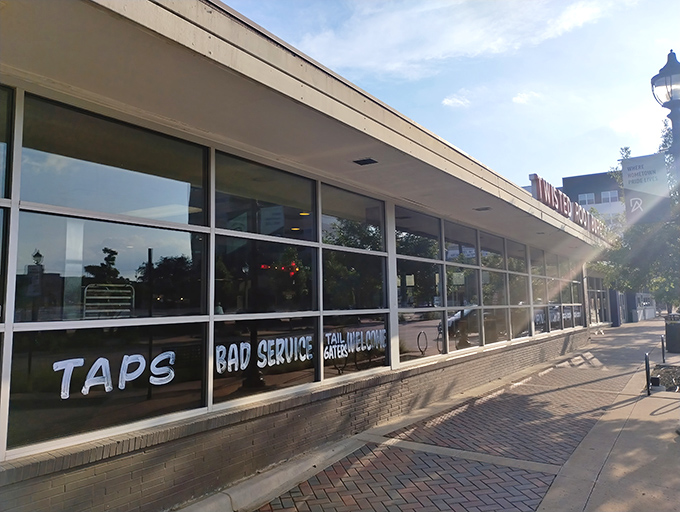 The storefront doesn't mince words with its "BAD SERVICE" window sign. Classic Texas humor that says "we're confident enough in our food to joke about ourselves."