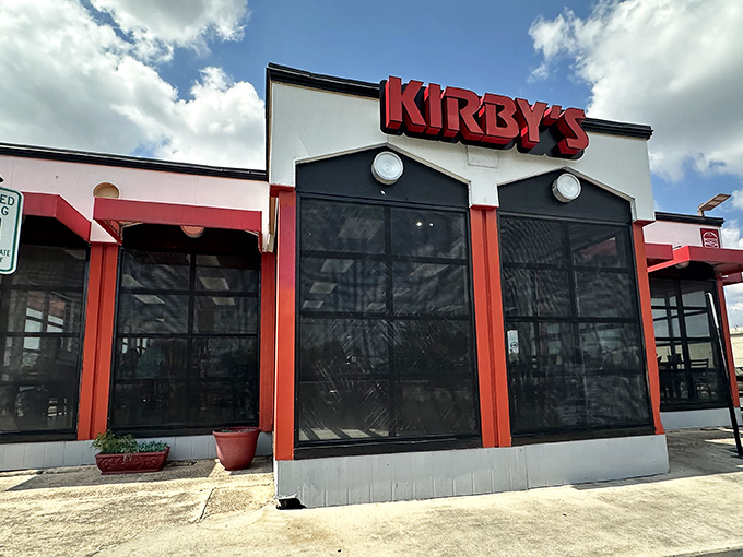 The red-trimmed exterior of Kirby's stands like a burger beacon in Seguin, promising delicious salvation for the hungry traveler.