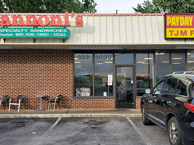 The iconic red sign beckons hungry travelers like a lighthouse for the sandwich-starved. This unassuming brick building houses Delaware's sandwich royalty.