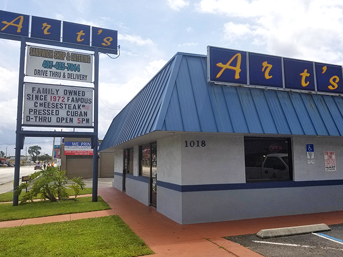 The iconic blue-roofed Art's beckons hungry travelers with its warning sign: "Caution: Our Food is Habit Forming." Truer words were never illuminated.