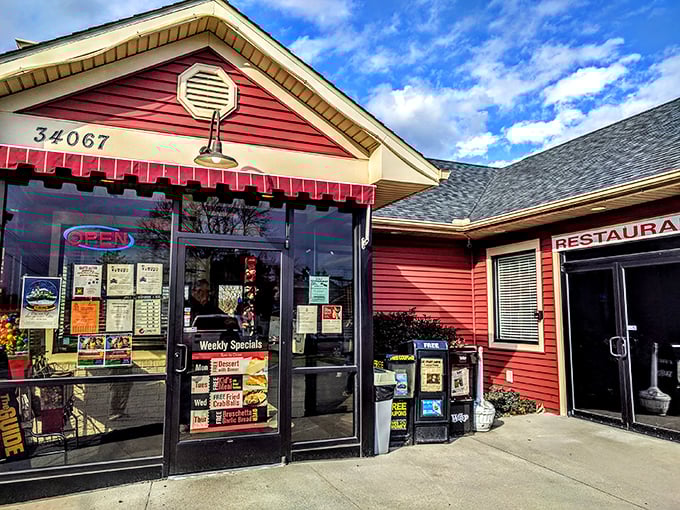 The classic red exterior of Frankford Family Diner stands like a beacon of comfort food hope along the Delaware roadside, promising delicious nostalgia with every visit.